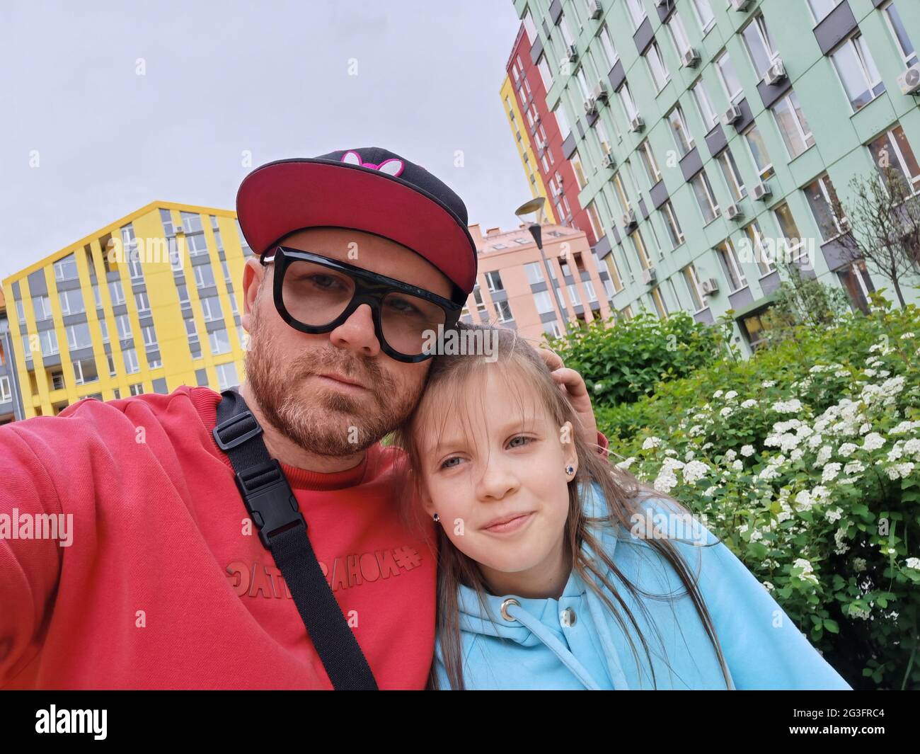 Father and daughter. Handsome young man and little cute girl make funny ...