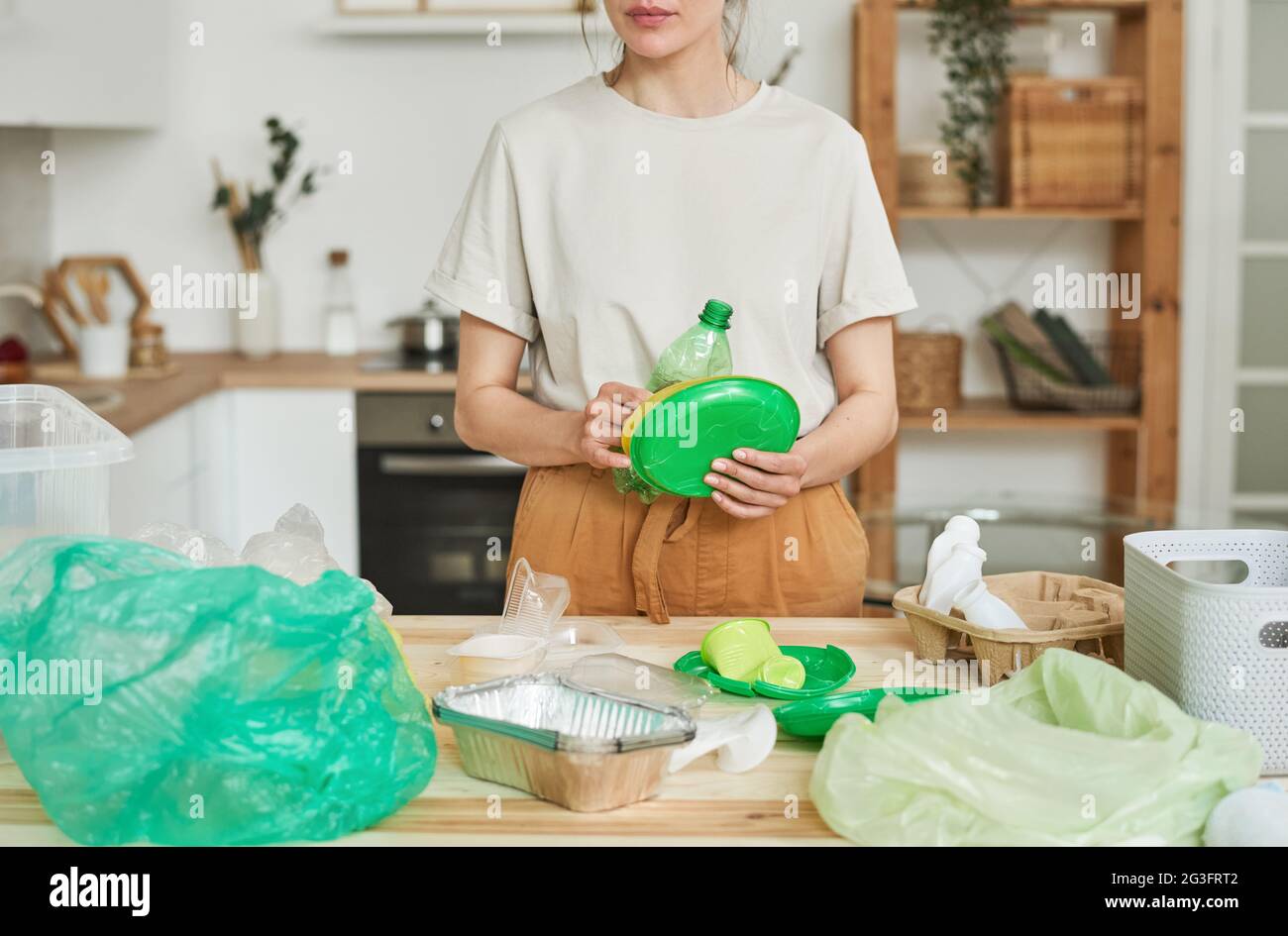 Woman interior garbage sorting hi-res stock photography and images - Alamy