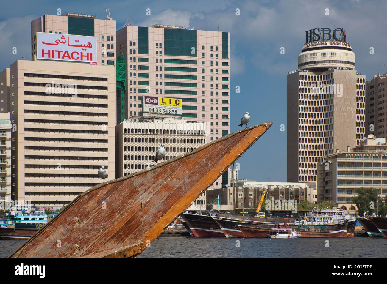 Dubai Creek, the river that flows through Dubai with a boats moored and ...