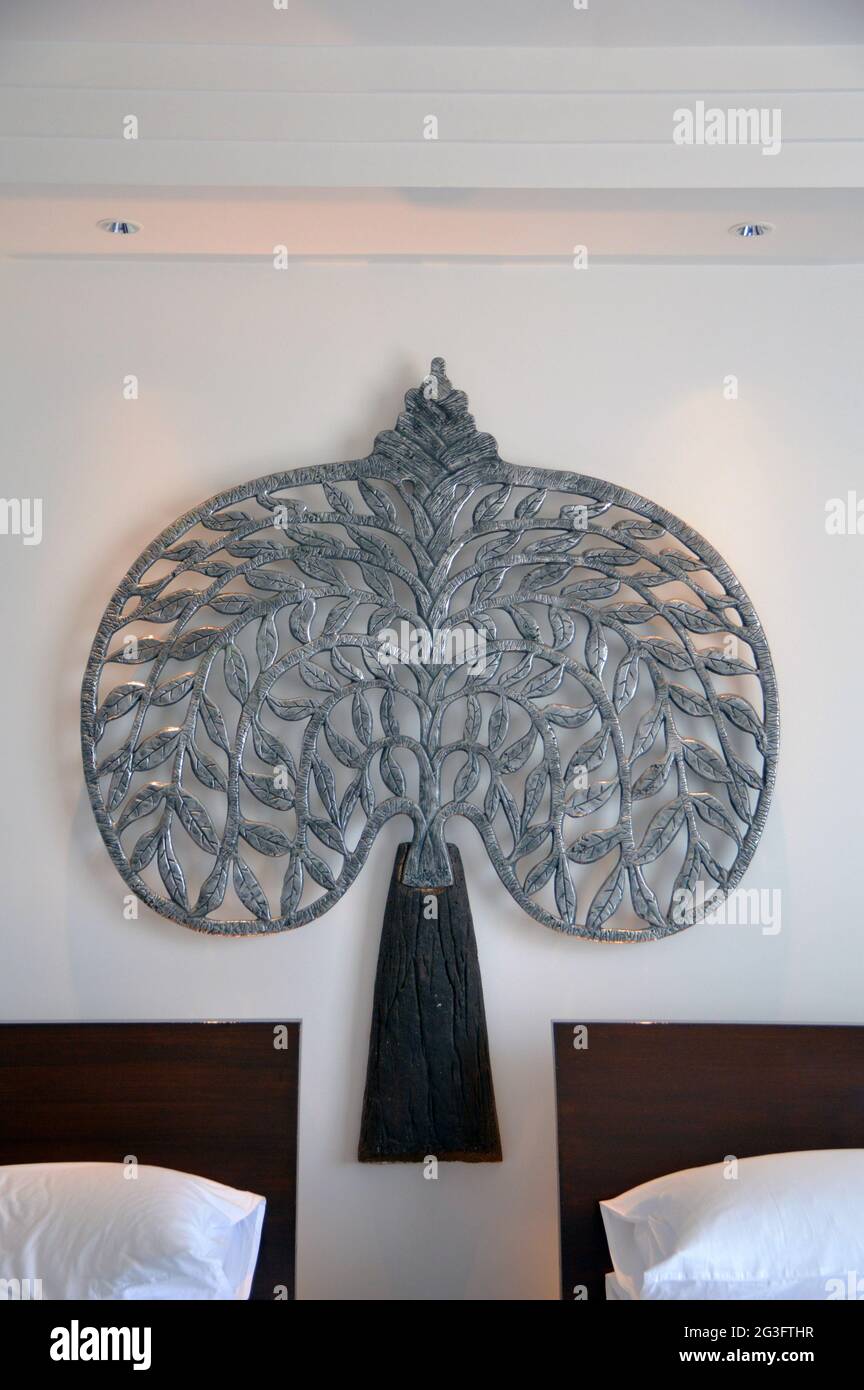 Traditional handmade Khmer mental tree used as bedhead decoration in a ...