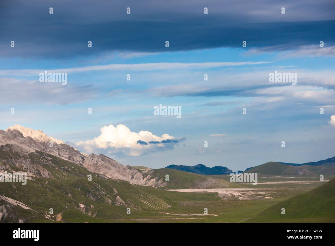 landscape with dramatic sky over mountains Stock Photo - Alamy