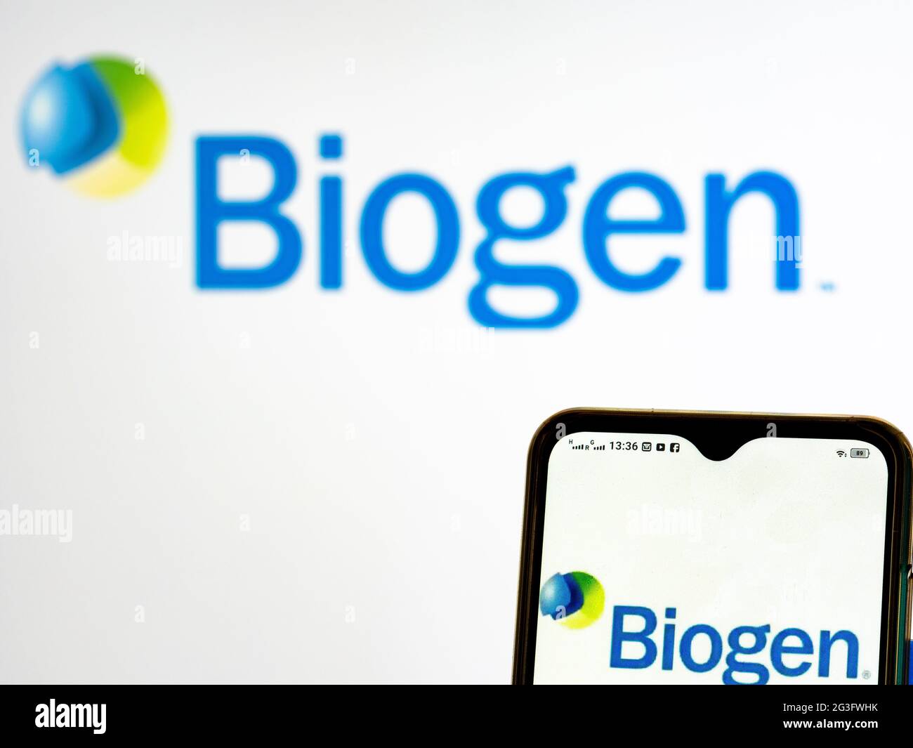 In this photo illustration a Biogen Inc. logo seen displayed on a ...