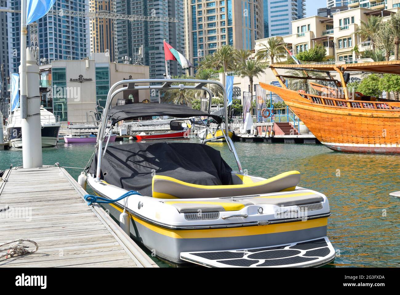 Luxury yachts in Dubai Harbour Marina, wooden boat Stock Photo - Alamy