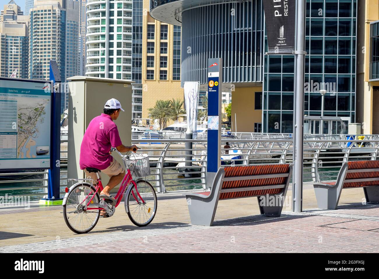 Back view of a tourist man riding a bicycle inside the city Stock Photo ...