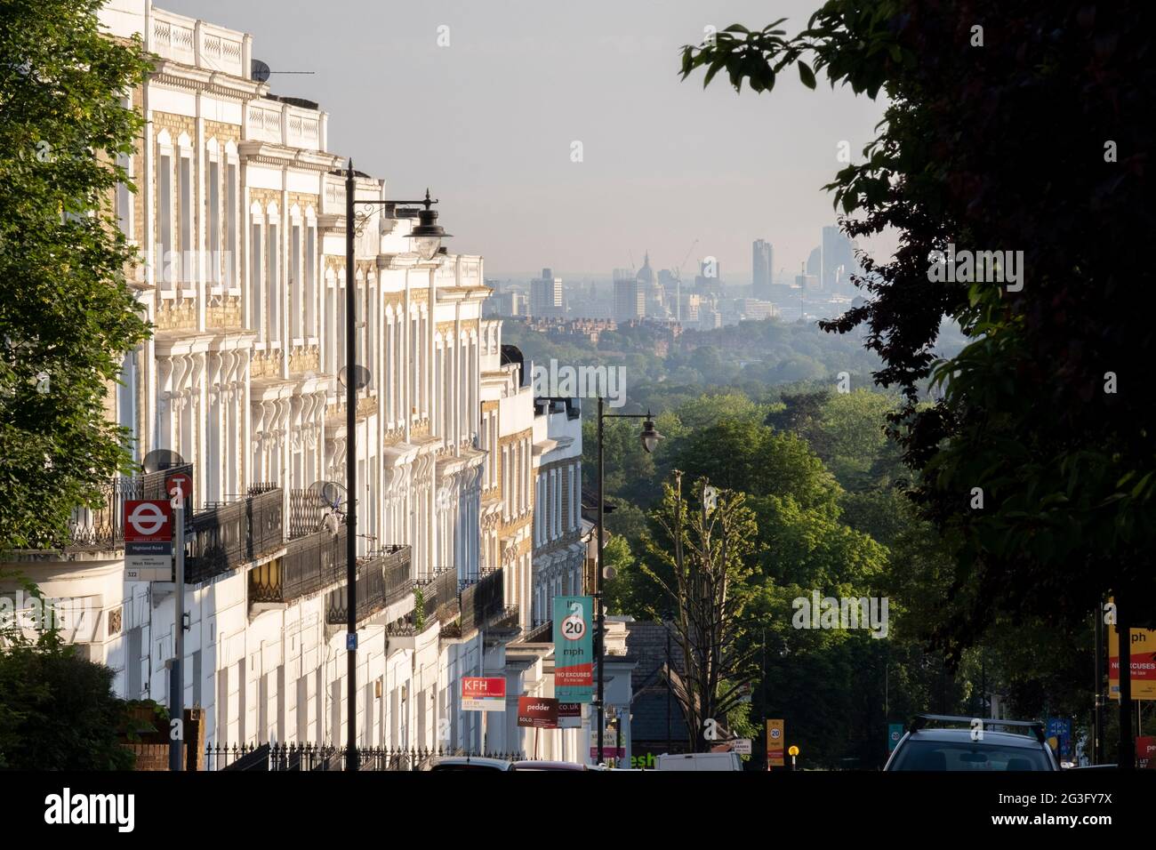 With the London skyline in the far distance, homes line the steep ...