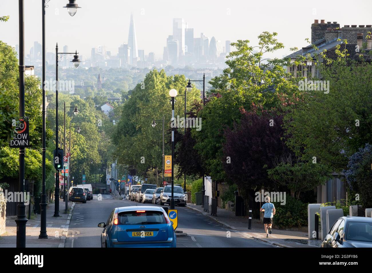 With the London skyline in the far distance, a runner descends the ...