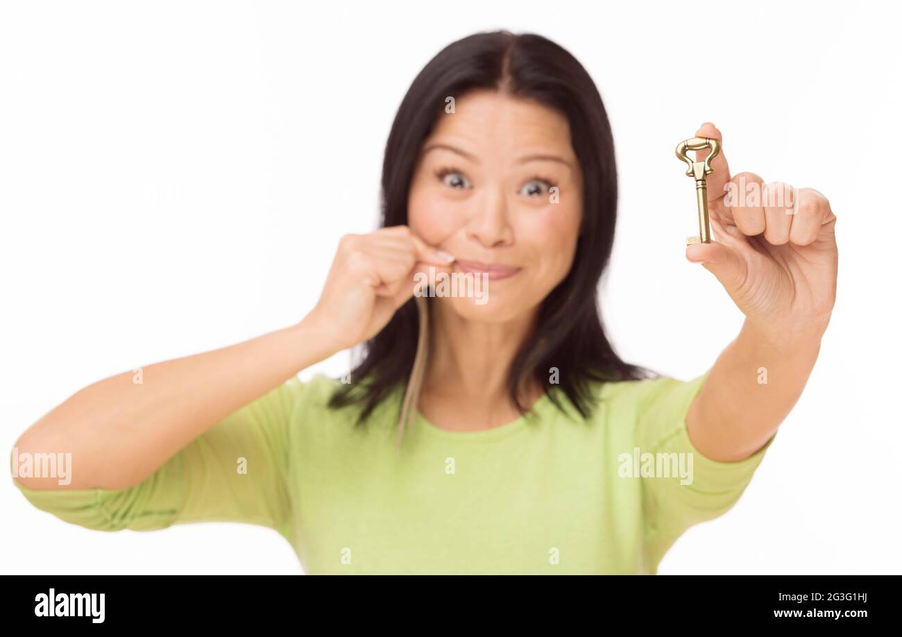 Woman locked mouth with key on white Stock Photo - Alamy