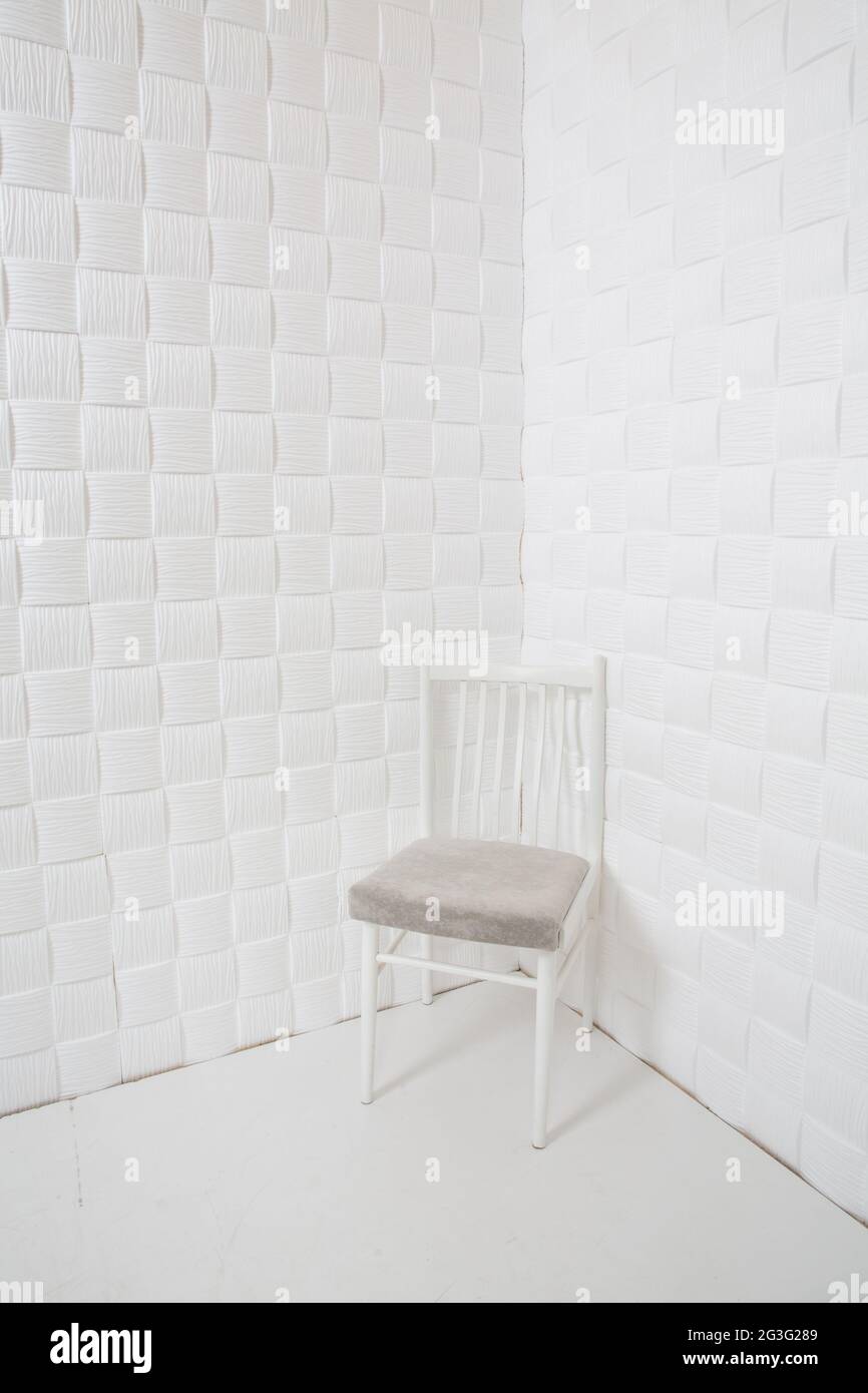 White chair isolated in room Stock Photo - Alamy