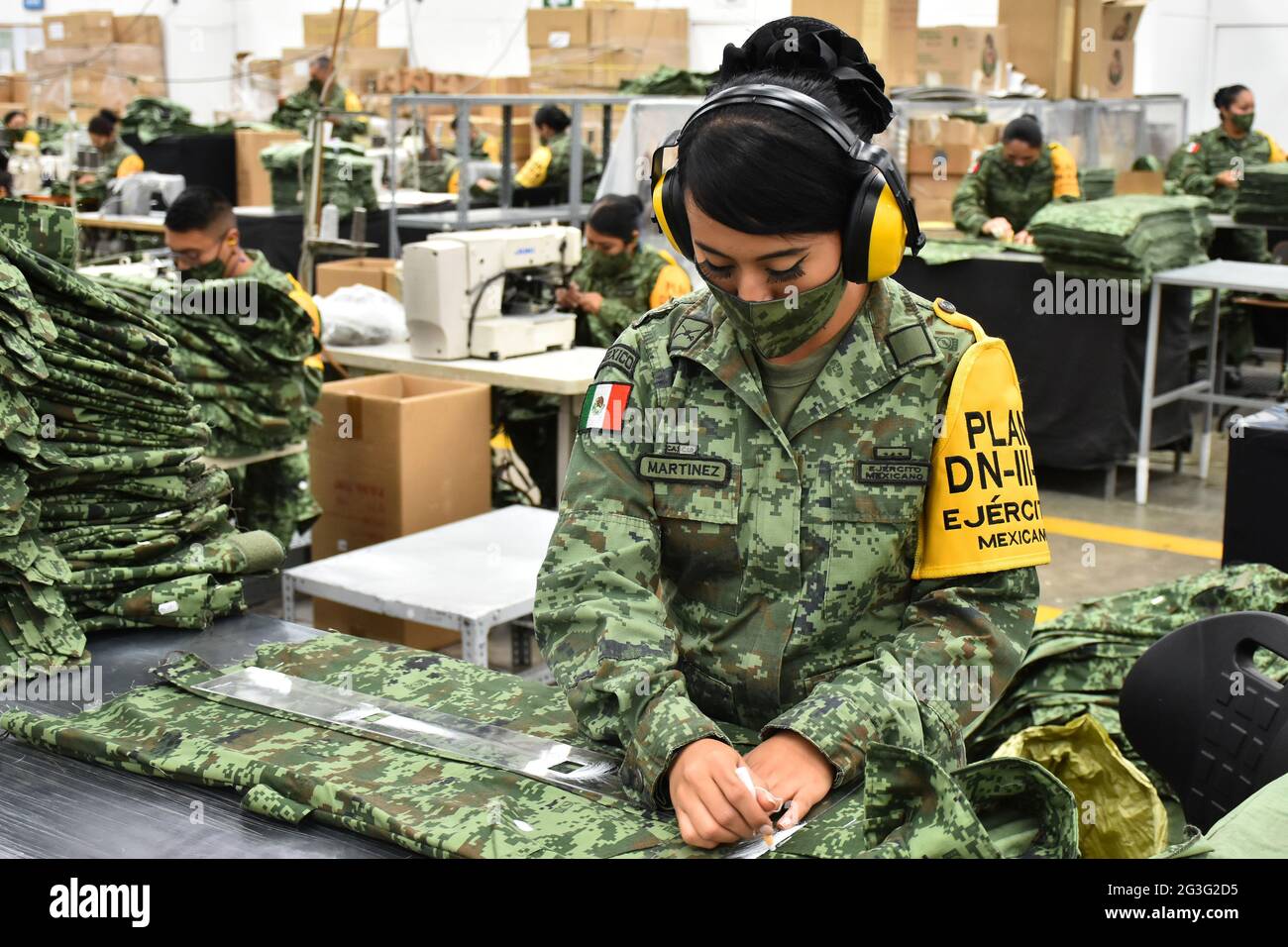 A military worker manufactures uniforms for members of Mexican Army at the Factory of Military ...
