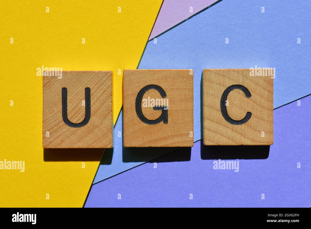 UGC, acronym for User Generated Content, in wooden alphabet letters ...