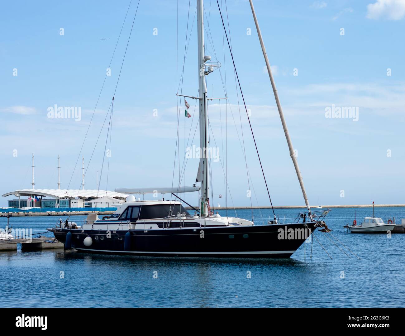 Side view boat in a pier, city mediterranean sea Stock Photo - Alamy