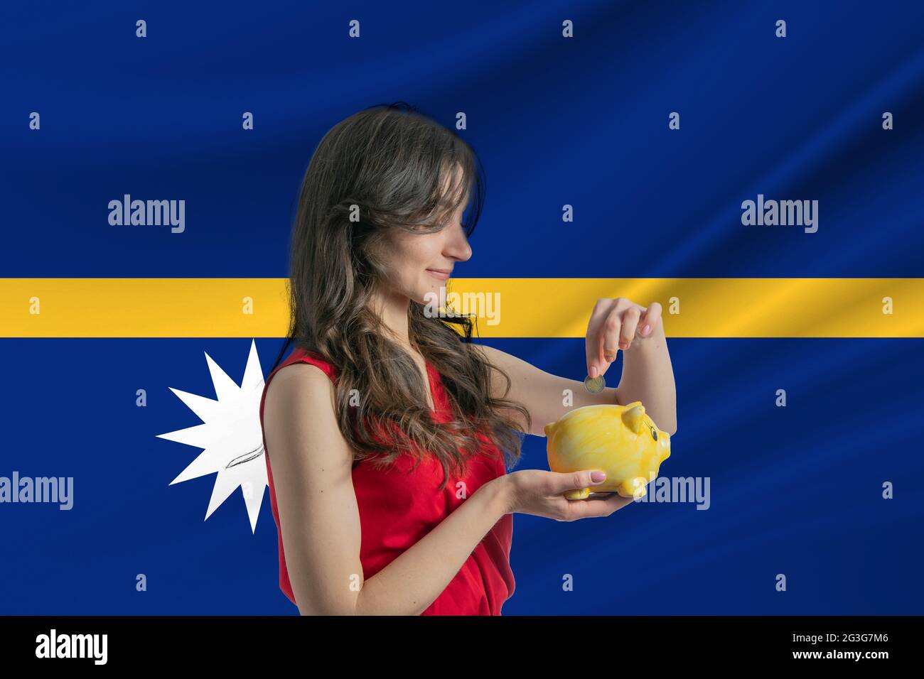 Economy in Nauru. Accumulating and saving money in Nauru. Woman putting ...