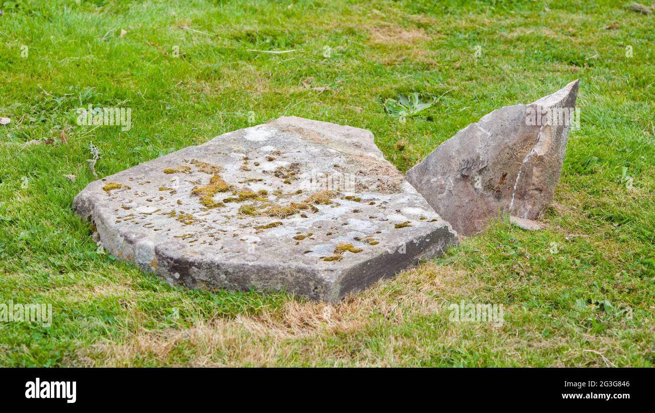 Very old broken gravestone in the cemetery Stock Photo - Alamy