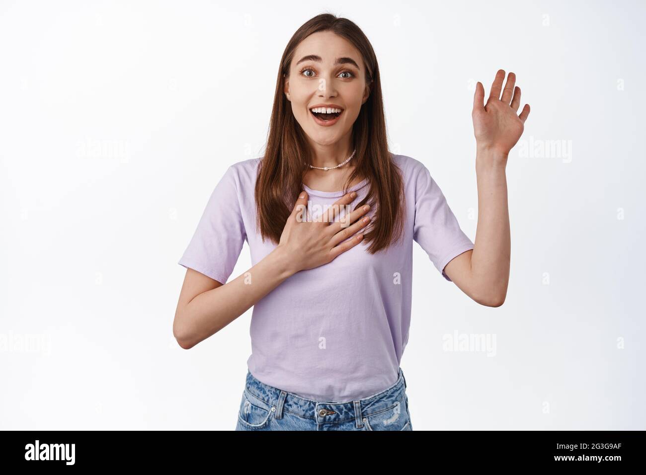 Its me. Hopeful smiling girl looks excited, raising hand and place one ...