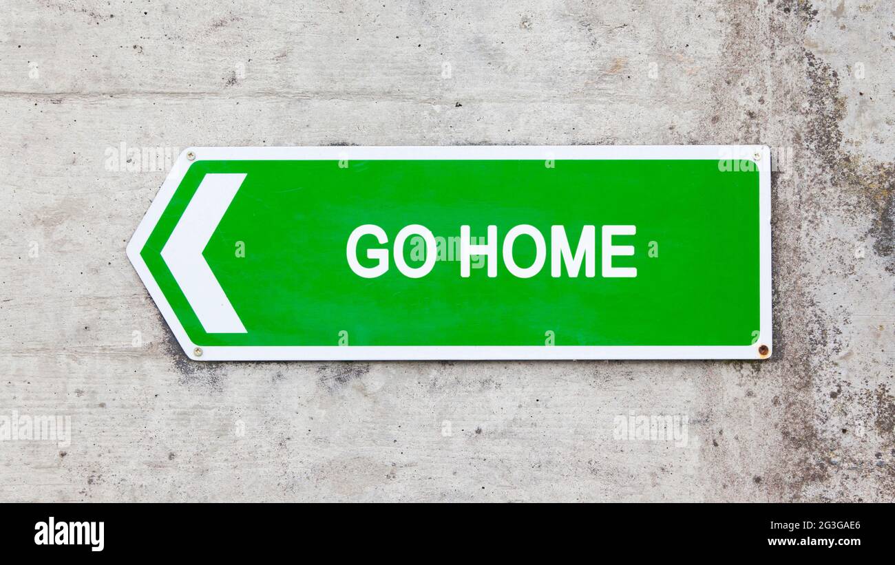 Green sign - Go home Stock Photo - Alamy