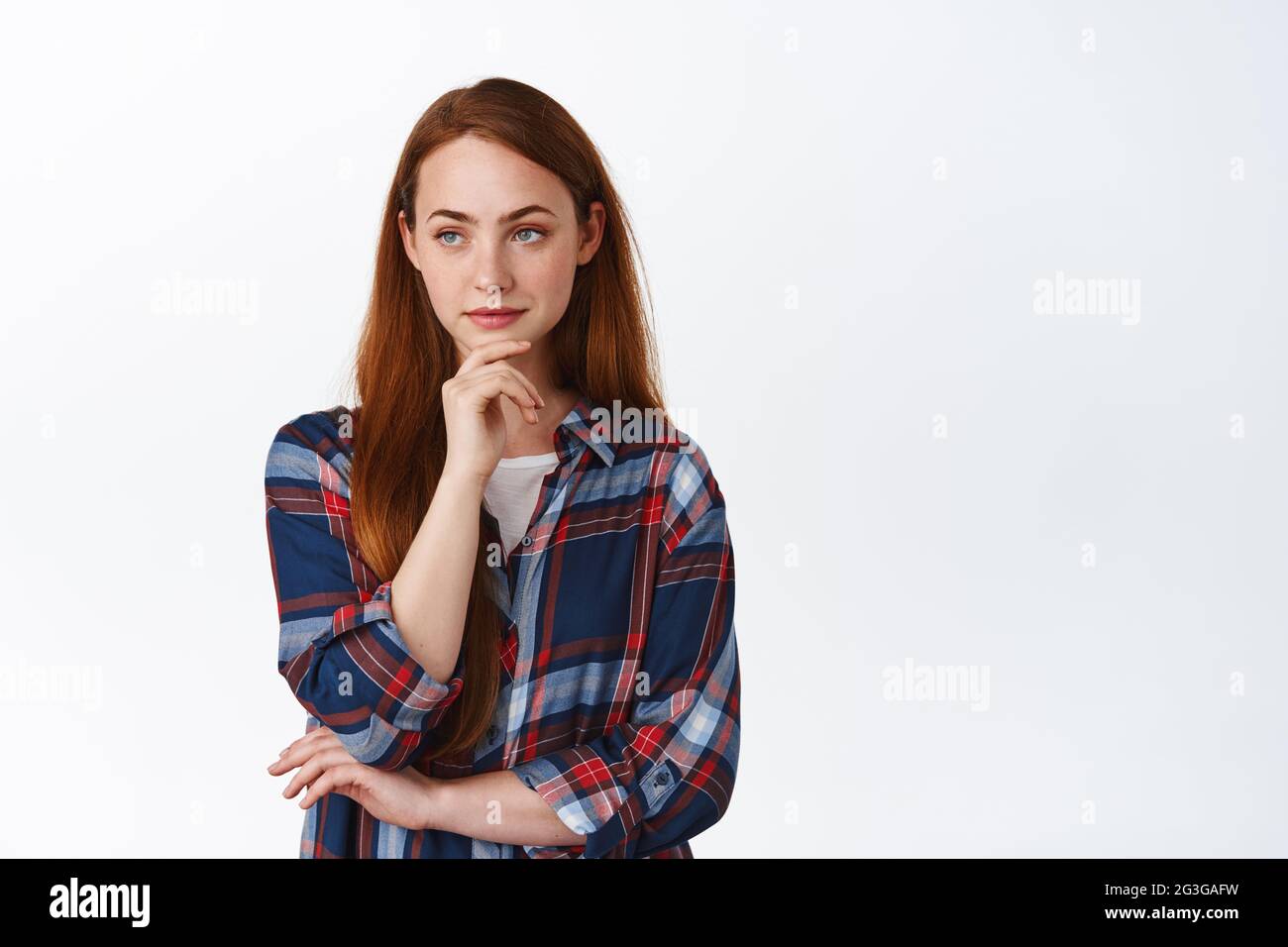 Thoughtful ginger girl with freckles, long natural hair, look left and ...