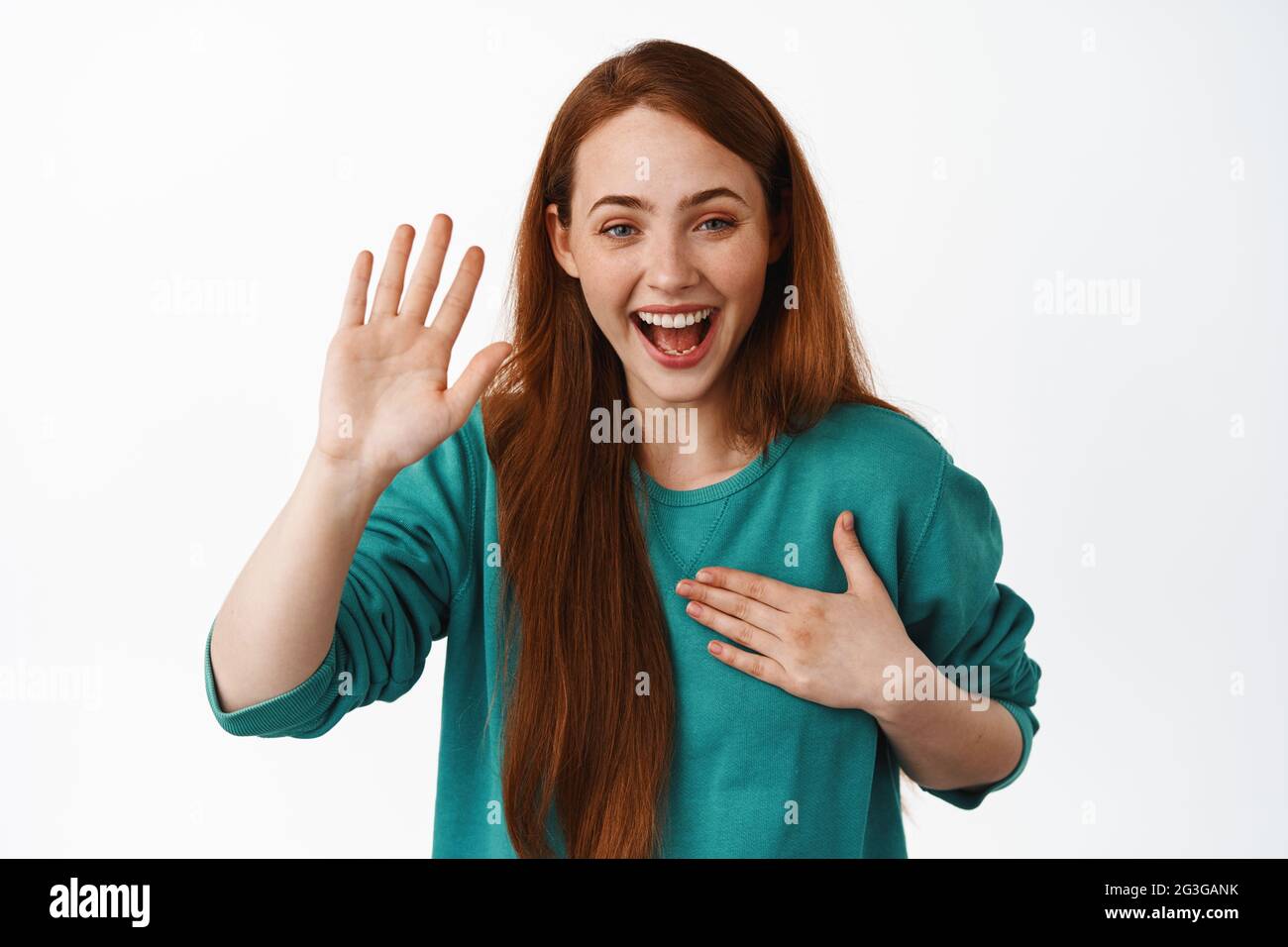 Portrait Of Friendly Happy Girl Laughing And Smiling Raising Hand And
