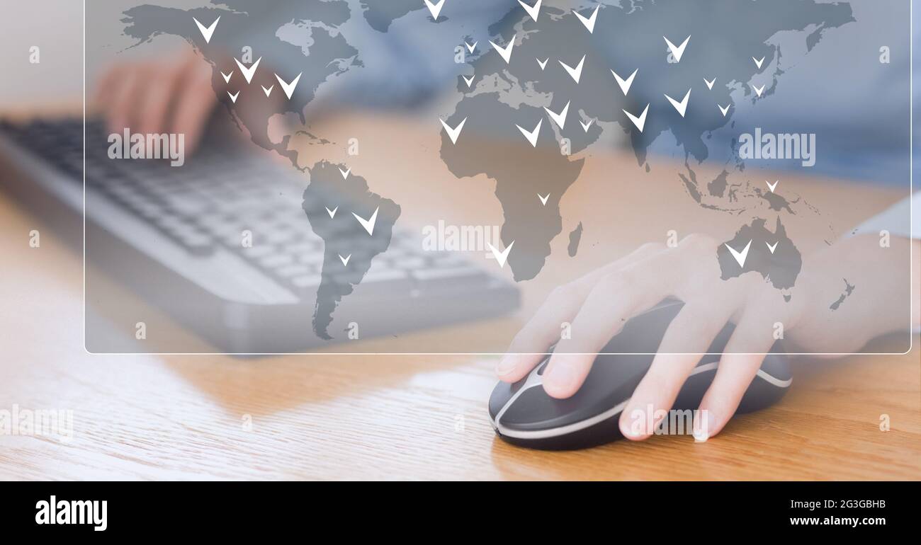 Multiple pointers over world map against mid section of person using ...