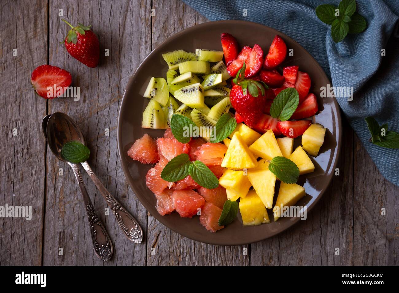 Fruit salad with cut fresh fruit and mint leaves Stock Photo - Alamy