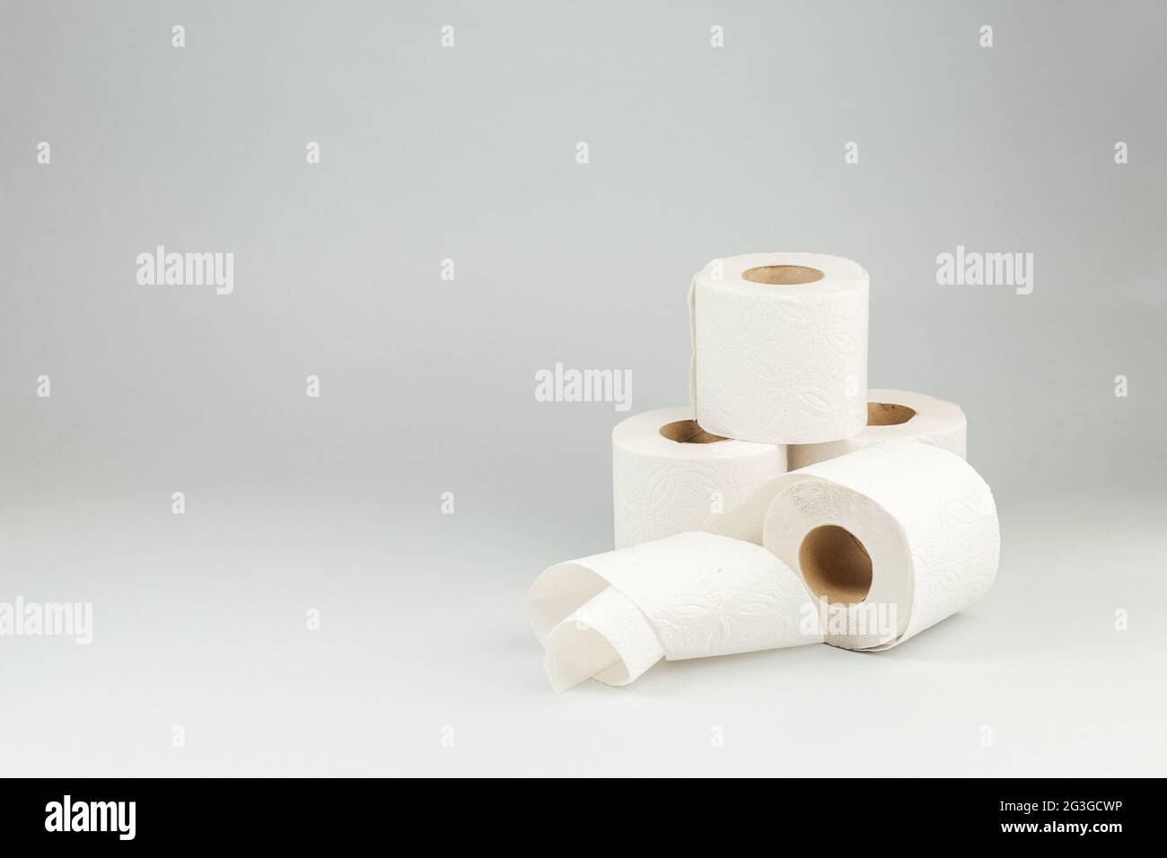 Rolls of Soft White Toilet Paper over Gray Background. Hygiene concept ...