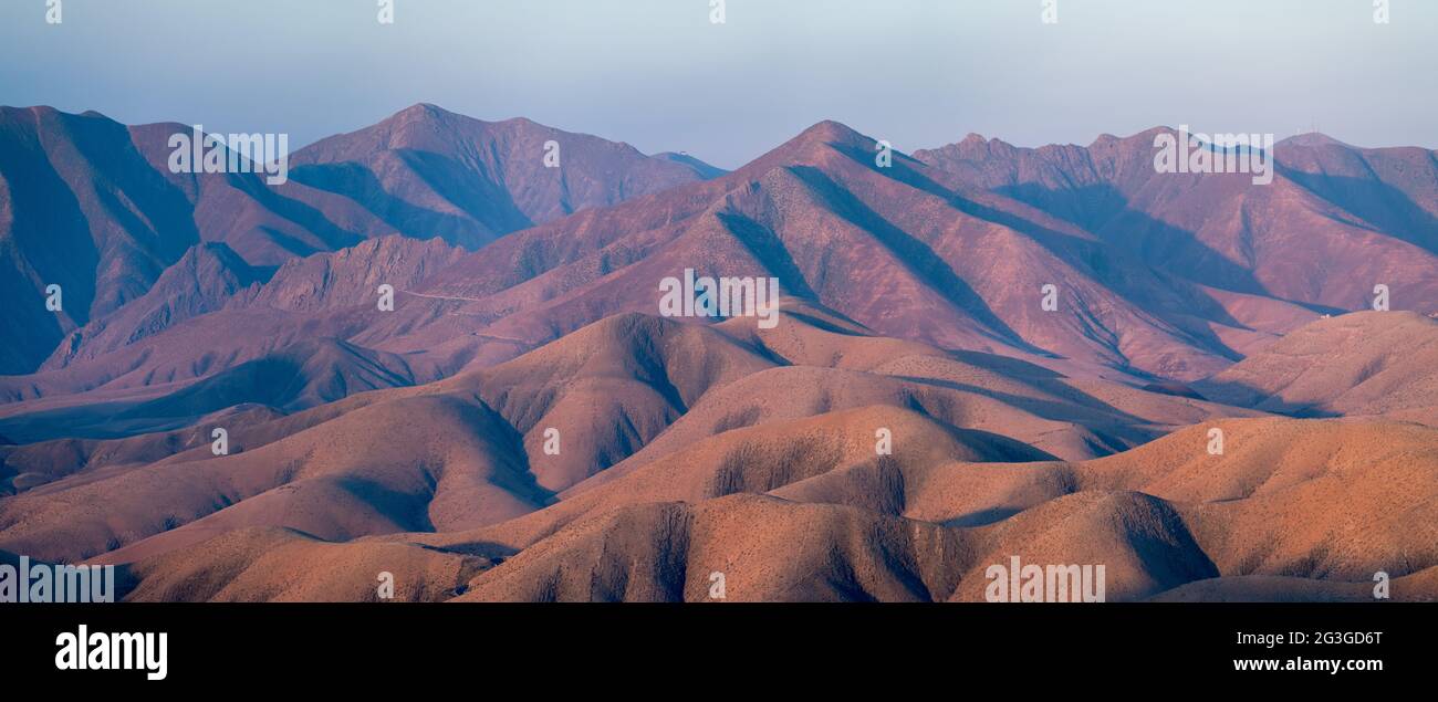Mountain range during sunset panorama Stock Photo - Alamy