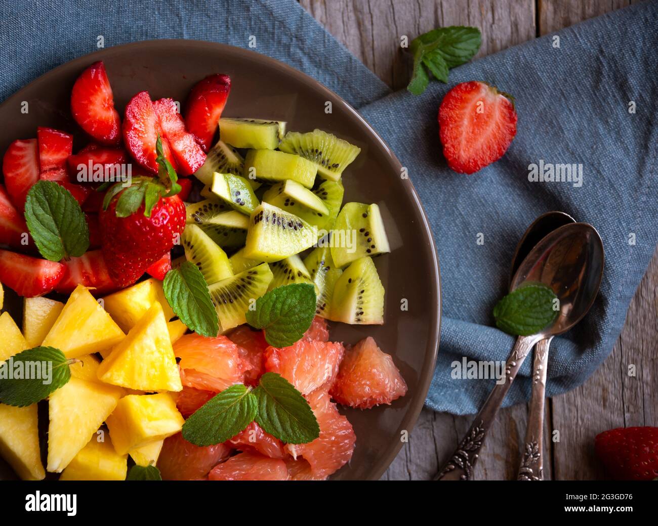 Fruit salad with cut fresh fruit and mint leaves Stock Photo - Alamy