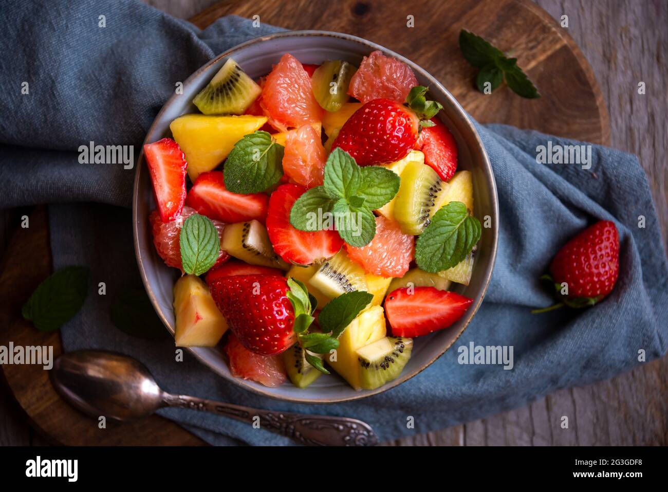 Fruit salad with cut fresh fruit and mint leaves Stock Photo - Alamy