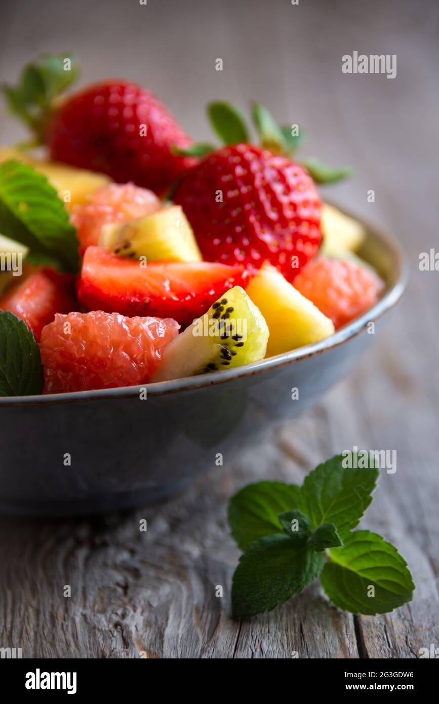 Fruit salad with cut fresh fruit and mint leaves Stock Photo - Alamy