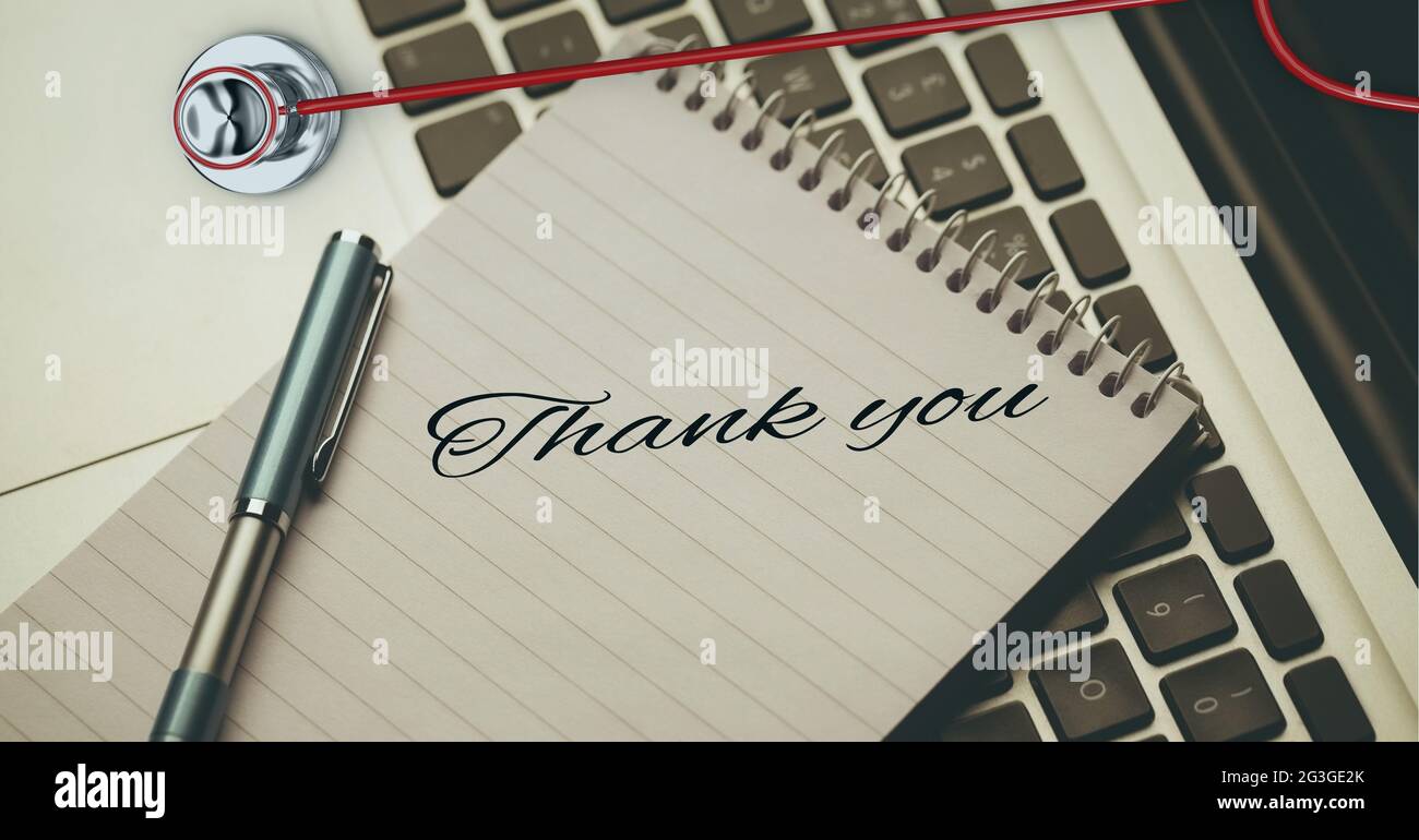 Thank you text, pen and stethoscope over diary against laptop keyboard ...
