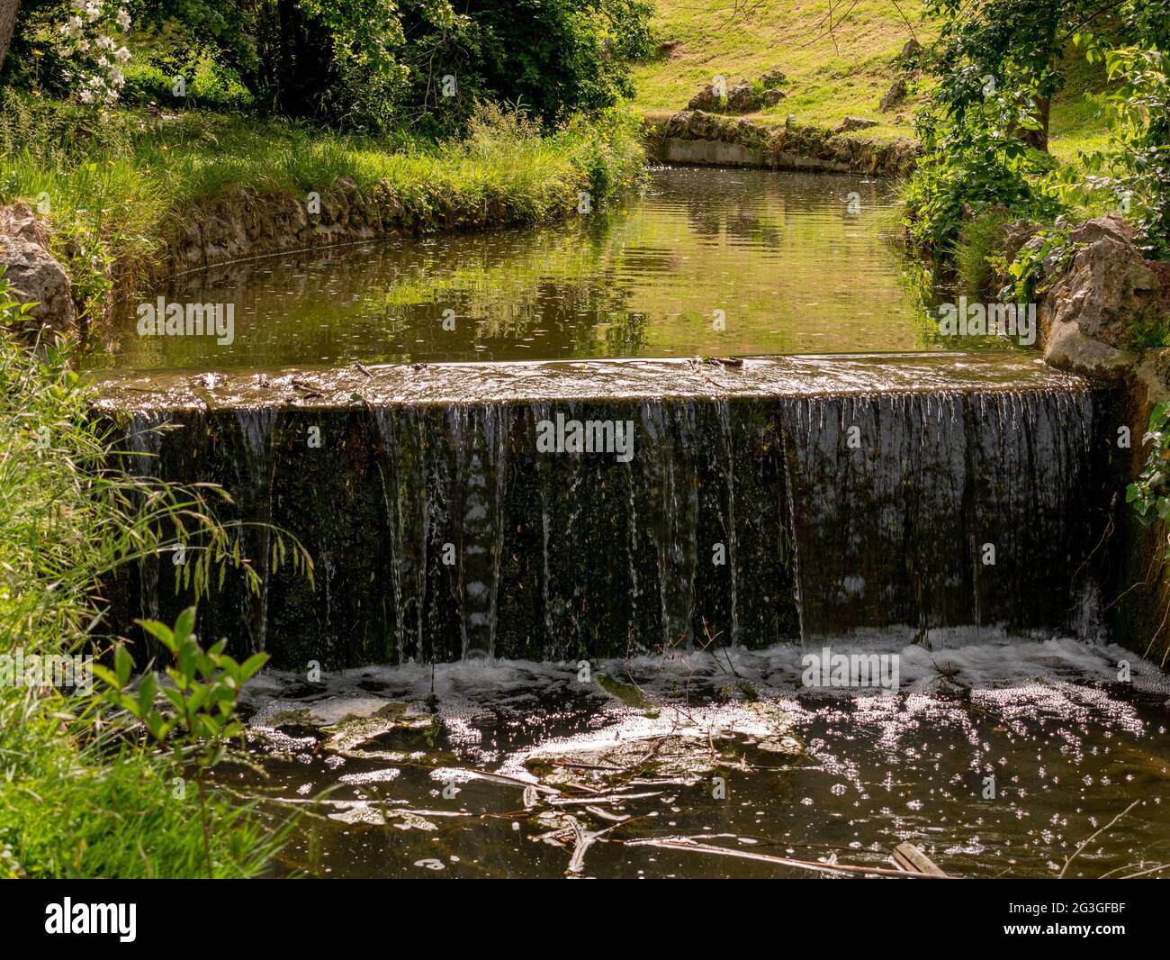 Natural view of water flowing downstream in irrigation in the ...