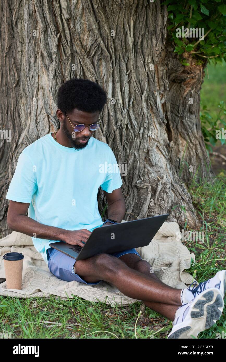 Person sitting in park hi-res stock photography and images - Alamy