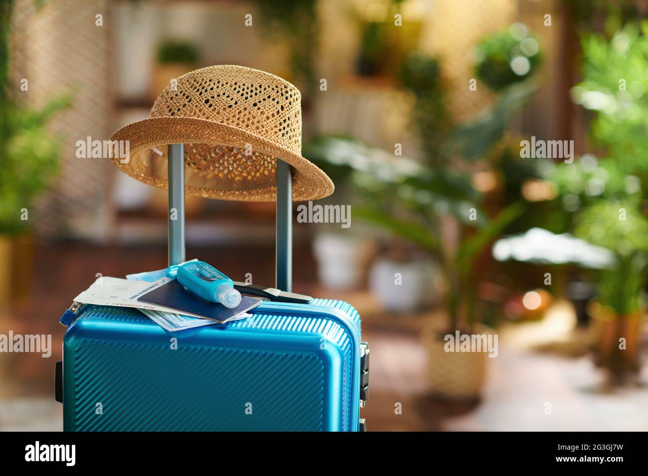Travel during covid-19 pandemic. trolley bag with disinfectant, medical ...