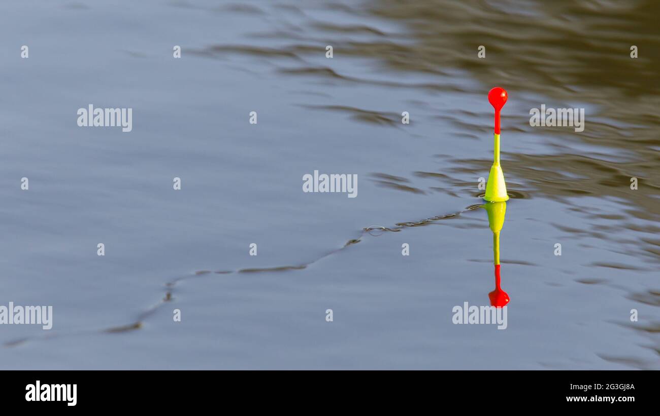 Fishing float floating Stock Photo - Alamy