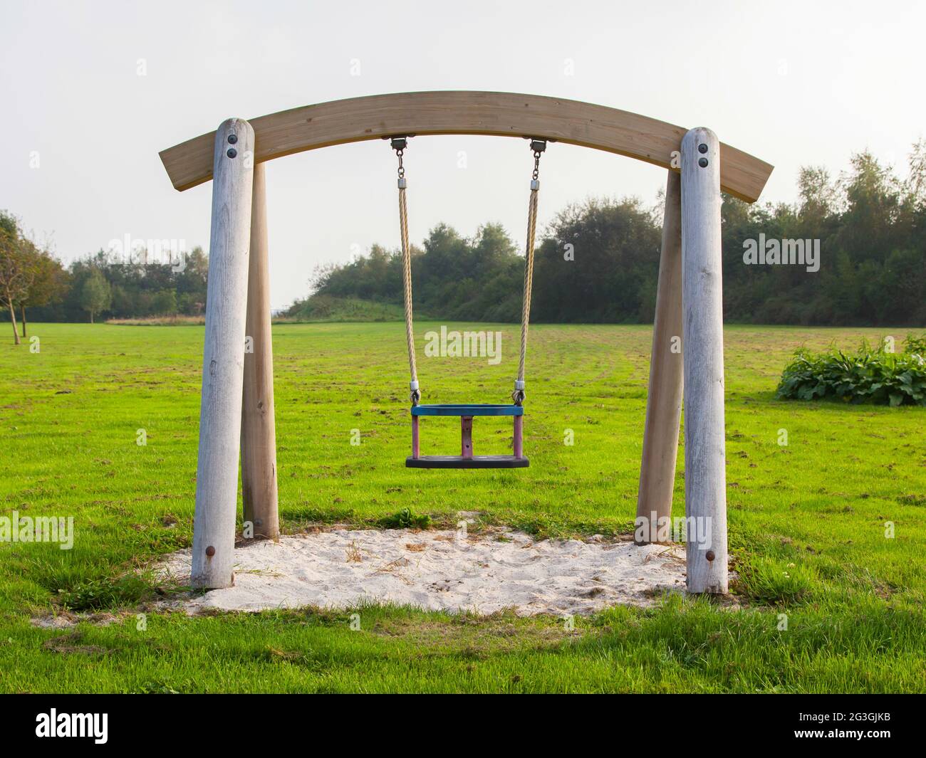 Swing in a park Stock Photo - Alamy