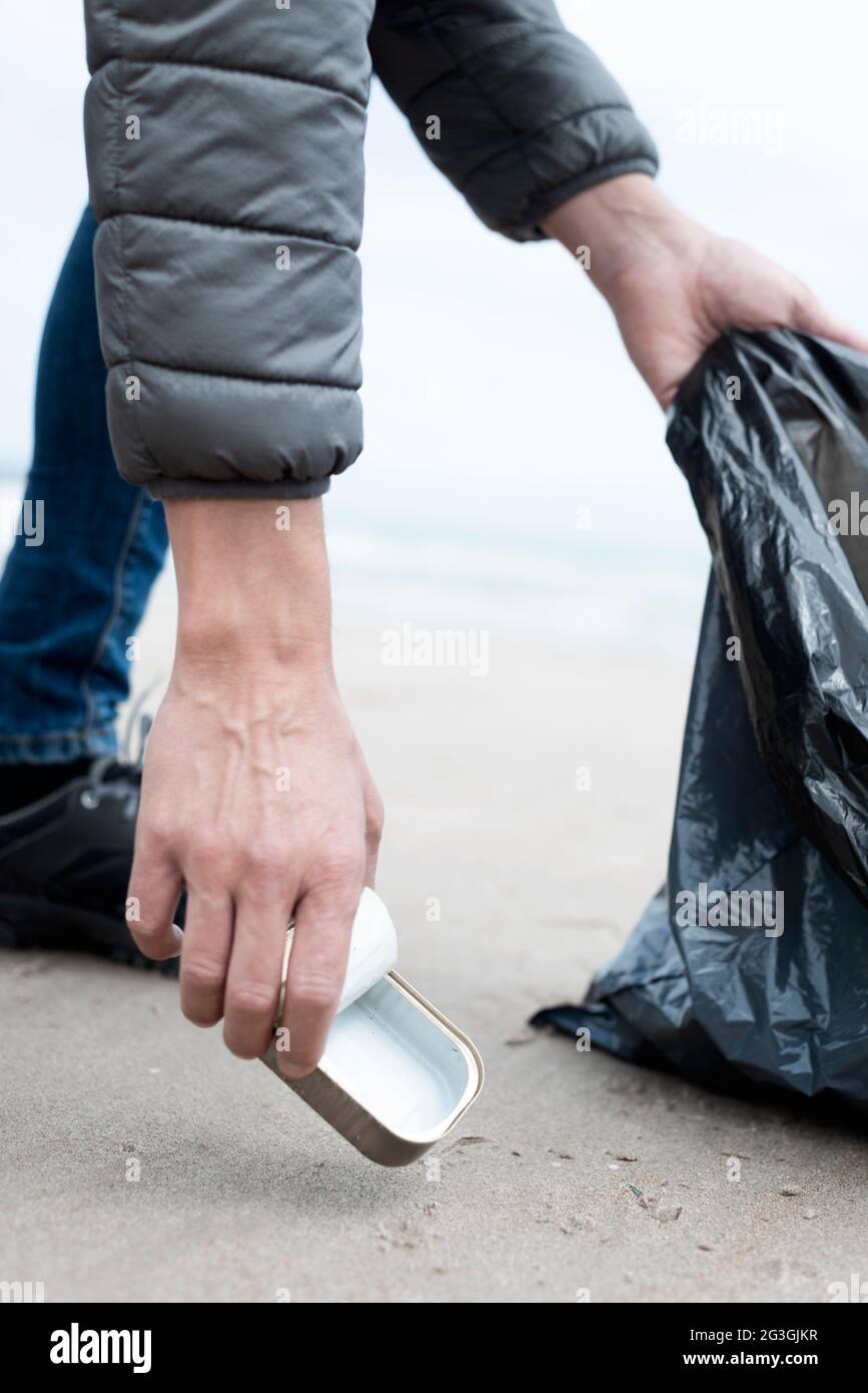 Man carrying trash bag hi-res stock photography and images - Alamy