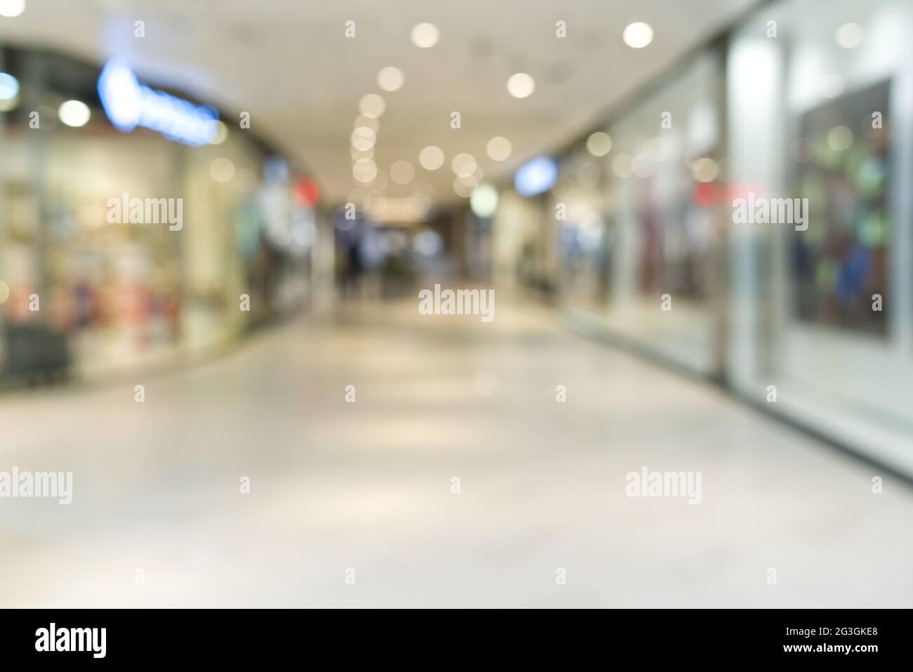 shopping mall blurred background. Light blur store interior with bokeh ...