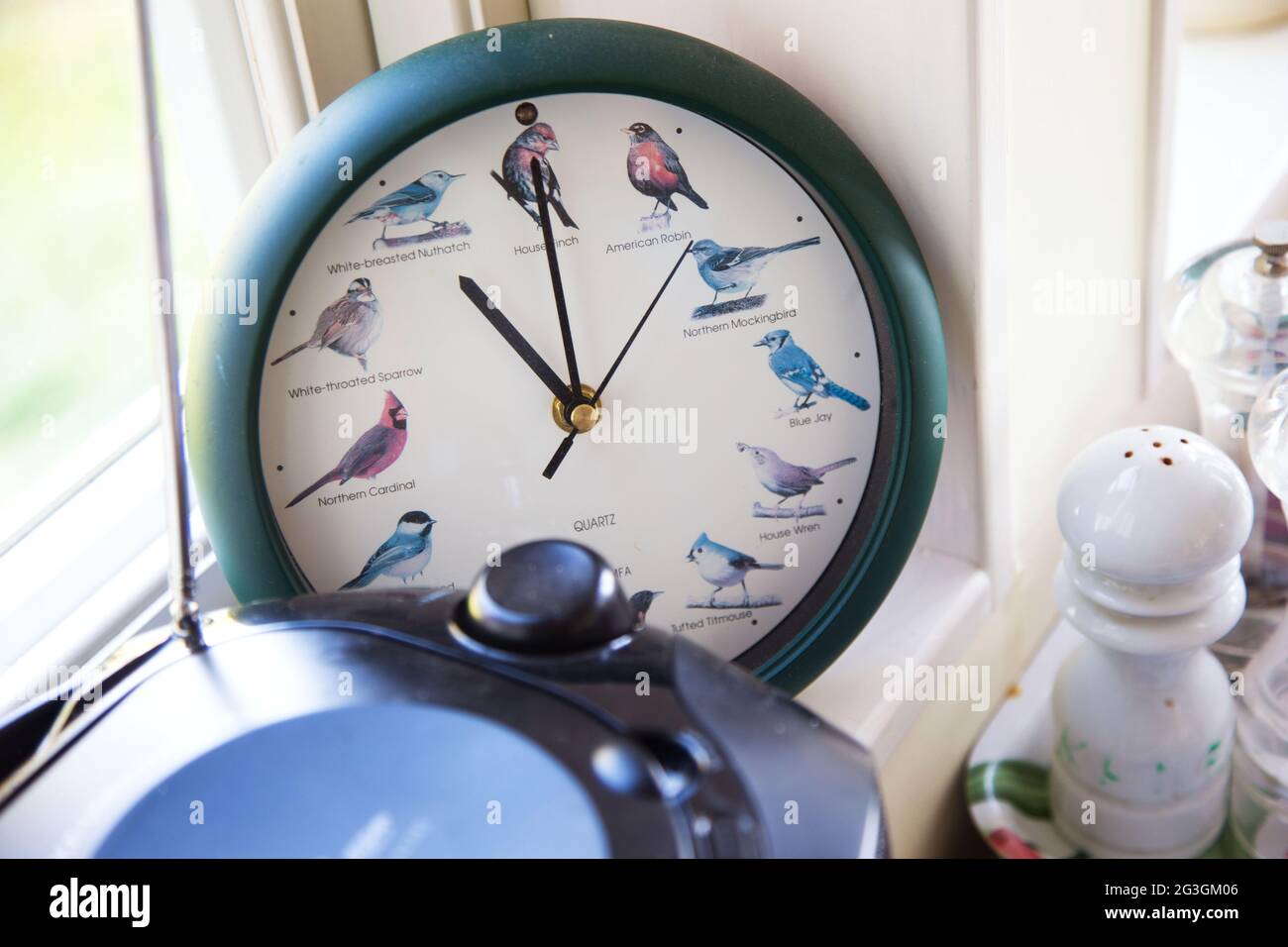 A clock with birds on Stock Photo - Alamy