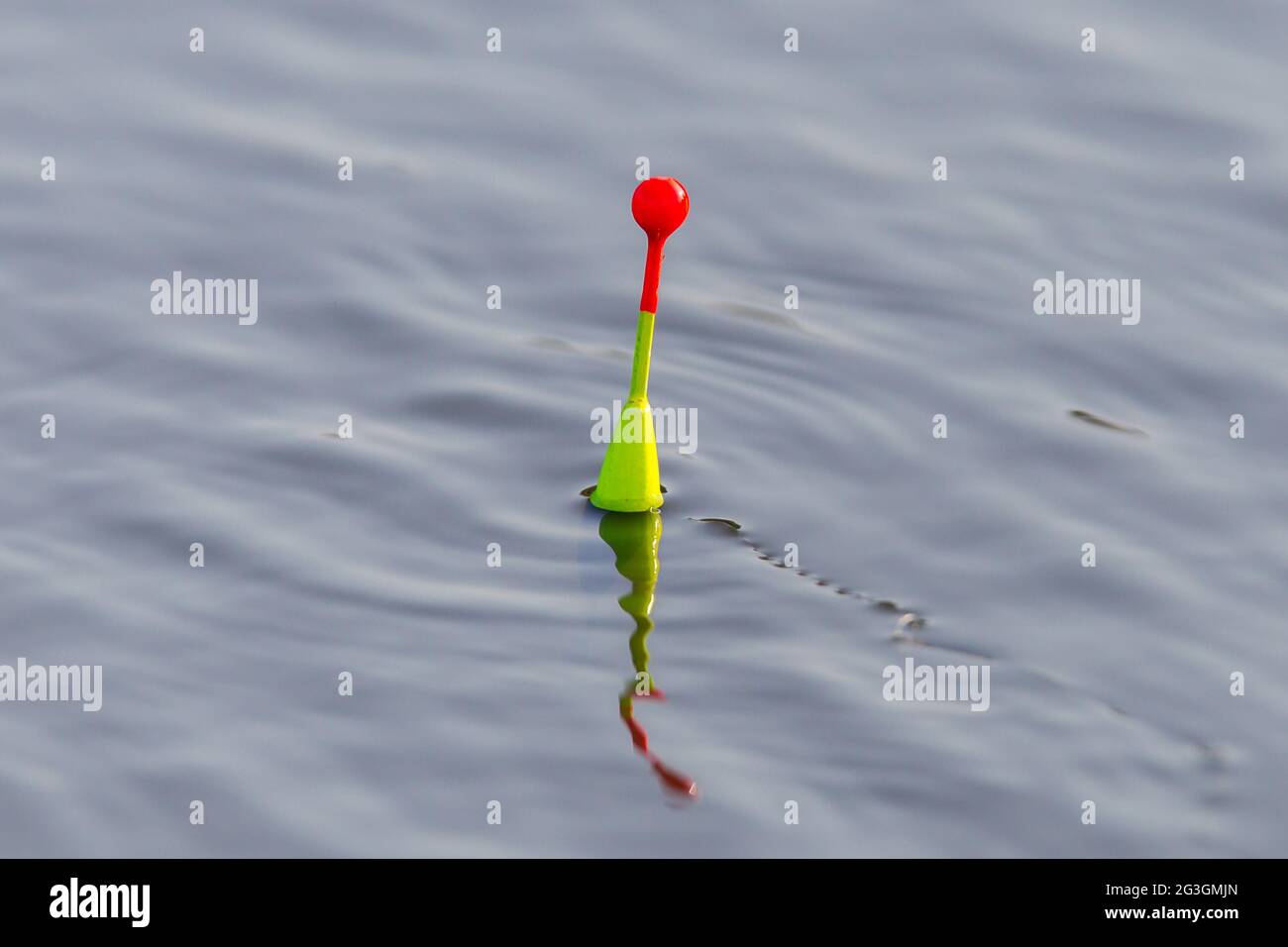 Fishing float floating Stock Photo - Alamy
