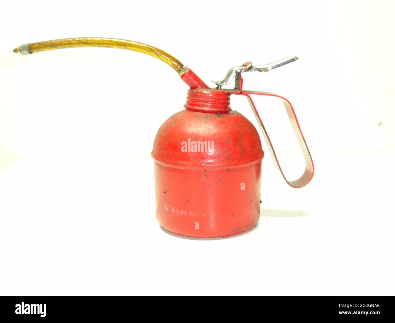 Old red oiler isolated in the white background Stock Photo - Alamy