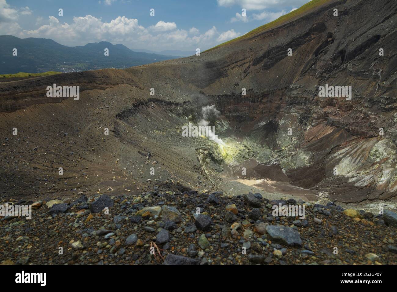 View of the Lokon volcano crater, a rugged landscape of rocky slopes ...