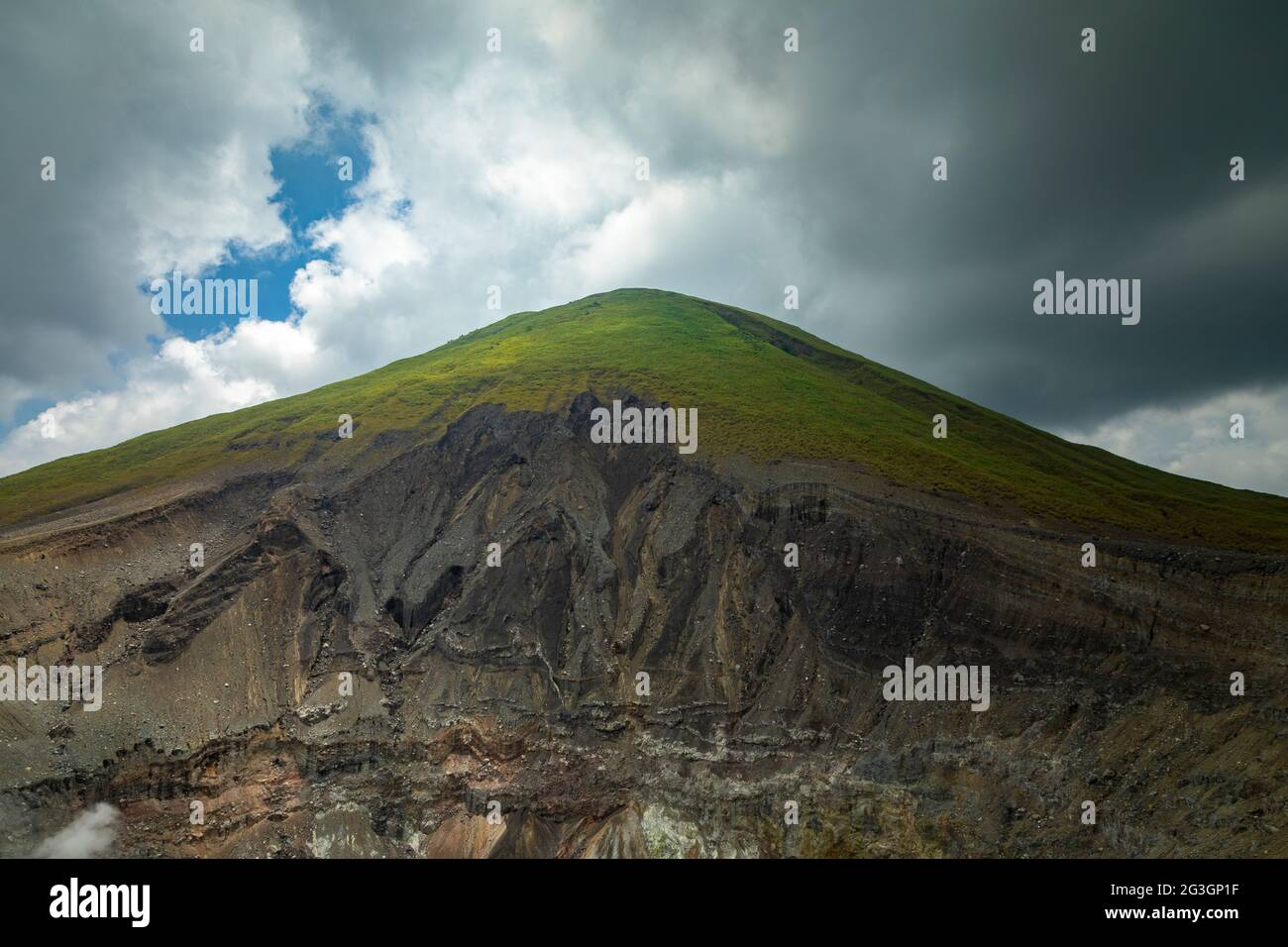 View of one of the peaks of Lokon volcano, and the rugged landscape of ...