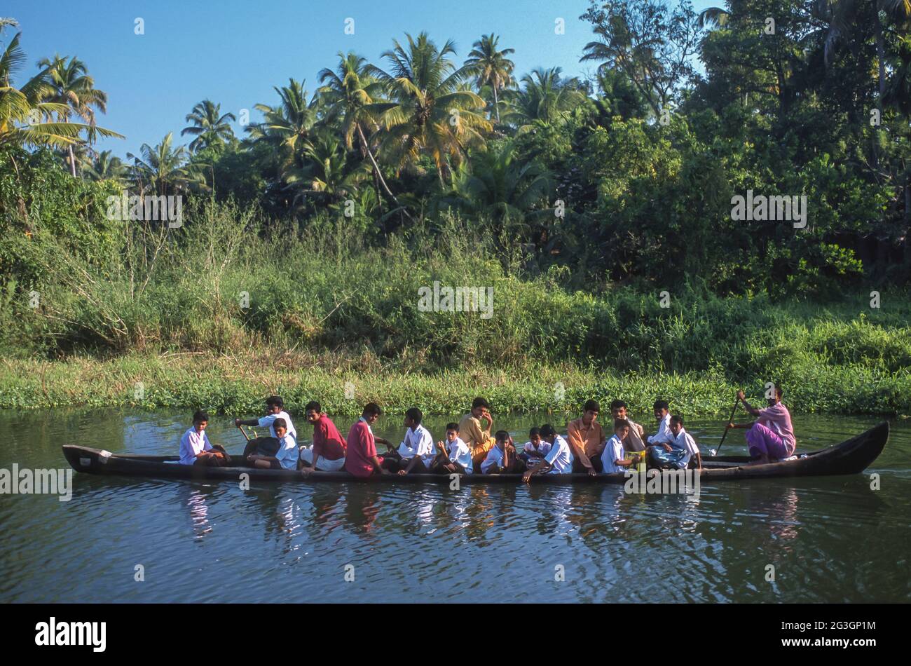 KERALA, INDIA - Small ferry boat canoe with passengers on Backwaters ...