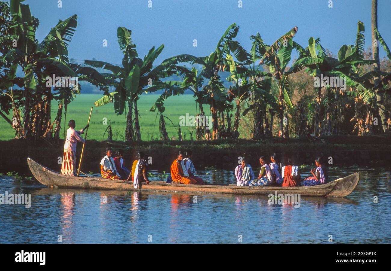 KERALA, INDIA - Small ferry boat canoe carries women passengers on ...