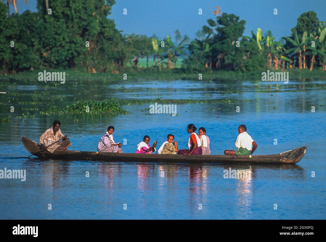 KERALA, INDIA - Small ferry boat carries passengers on Backwaters canal ...