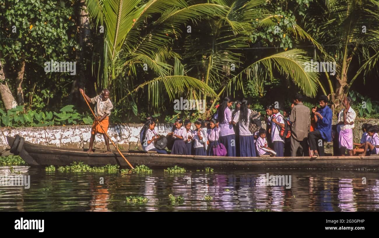KERALA, INDIA - Small ferry boat carries school children on Backwaters ...