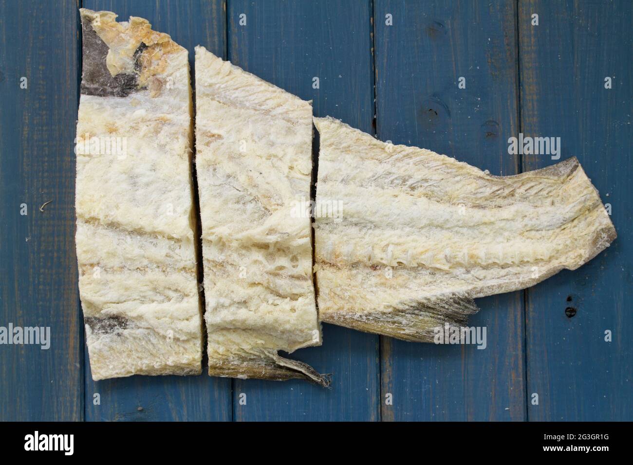 cod fish on blue background Stock Photo - Alamy