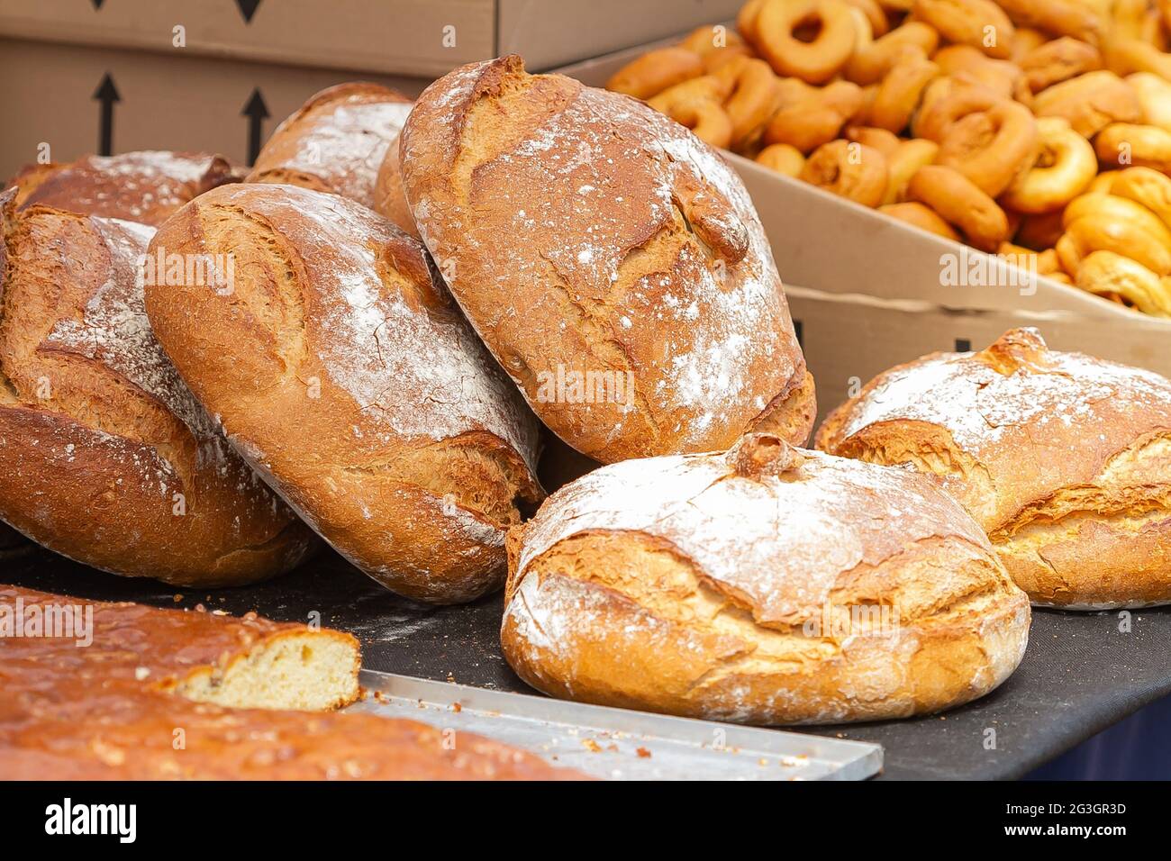 Galician rustic bread with homemade doughnuts in the background Stock ...