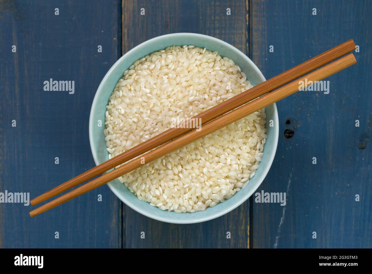 rice in blue bowl Stock Photo - Alamy