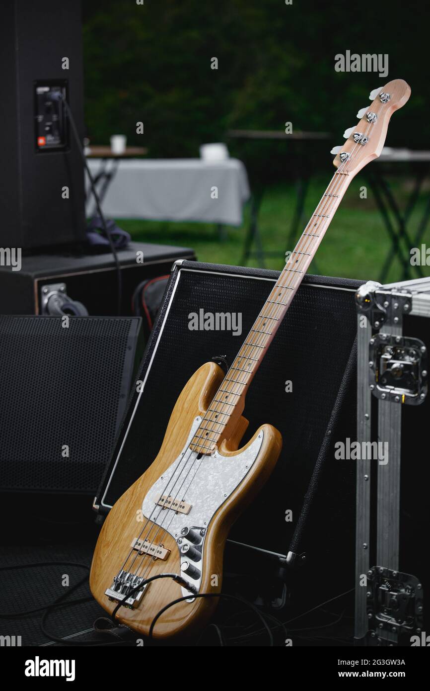 Bass guitar and the amp on the outdoor stage Stock Photo - Alamy