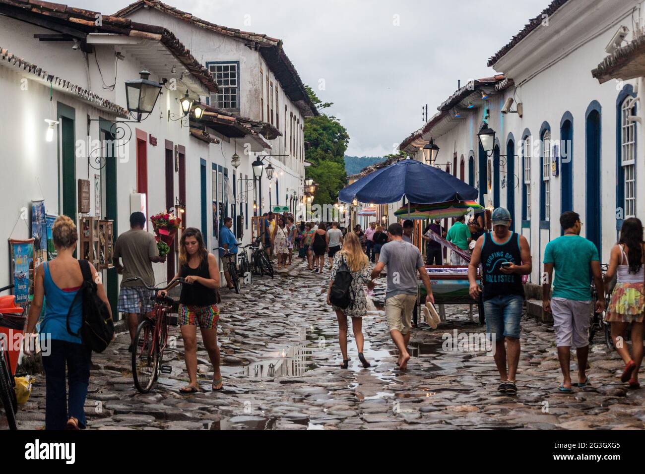 PARATY, BRAZIL - JANUARY 30, 2015: People walk in a narrow street an ...